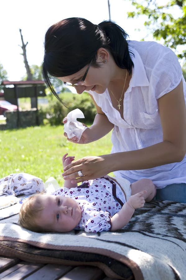 Mother changing nappy stock photo. Image of nappy, cares - 15302118