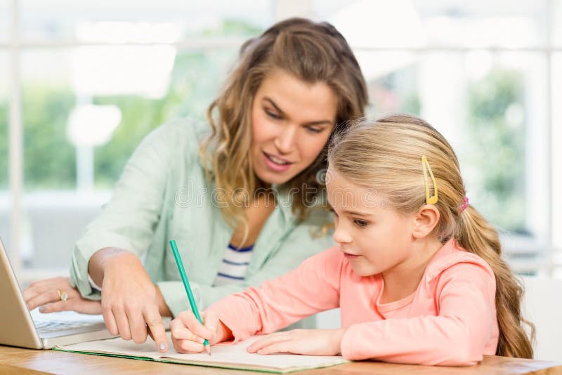 Mother Checking Daughters Homework Stock Photo - Image of domestic ...