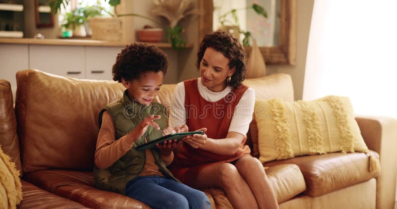 Mother, Child and Game on Tablet on Sofa for Bonding, Cognitive ...