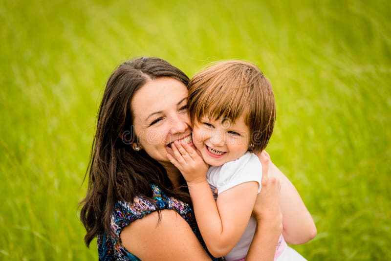 Mother and child hugging stock photo. Image of outside - 65587812