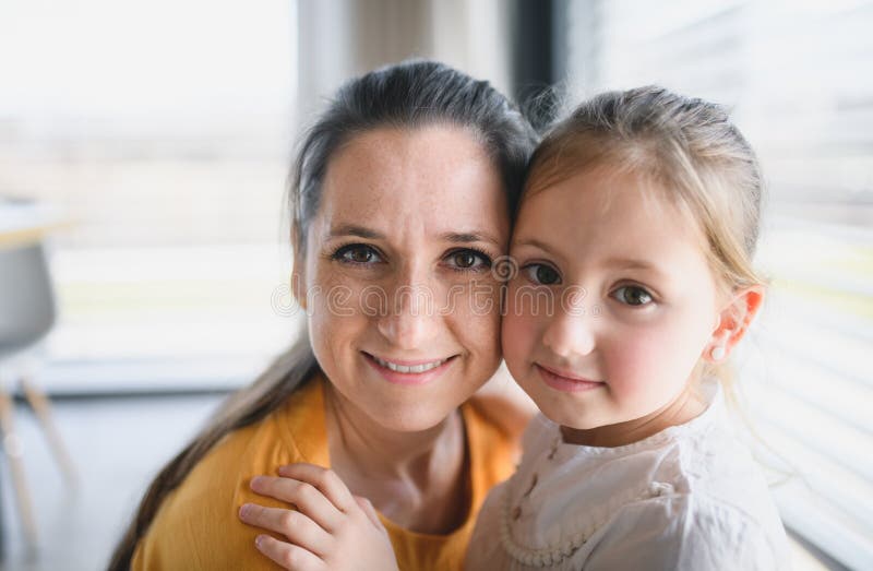 Mother and Child Indoors at Home, Looking at Camera. Stock Image ...