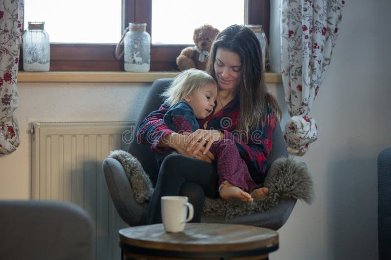 Mother and Child, Sitting in Rocking Chair Stock Photo - Image of ...