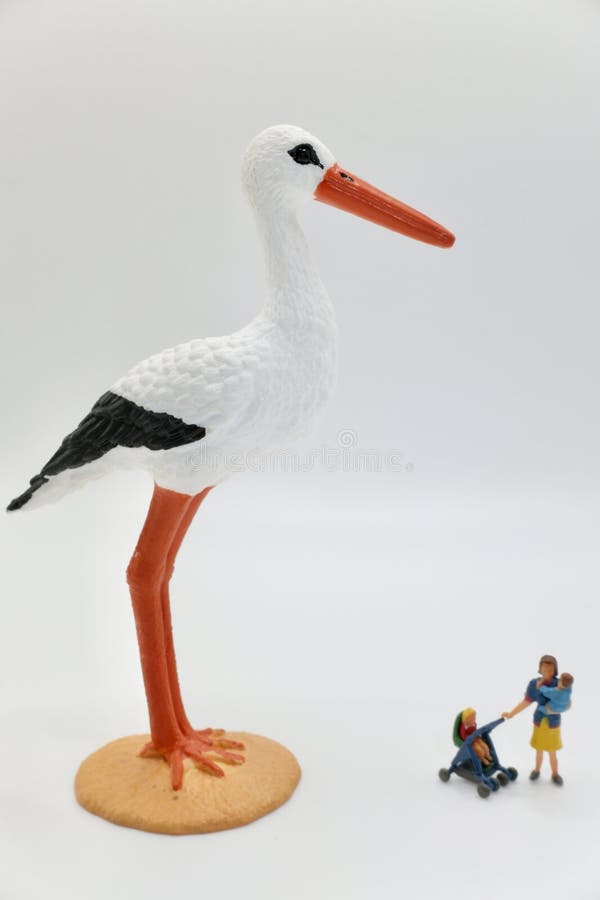 Mom with Child and a Stork Miniature Figurines Stock Photo - Image of ...