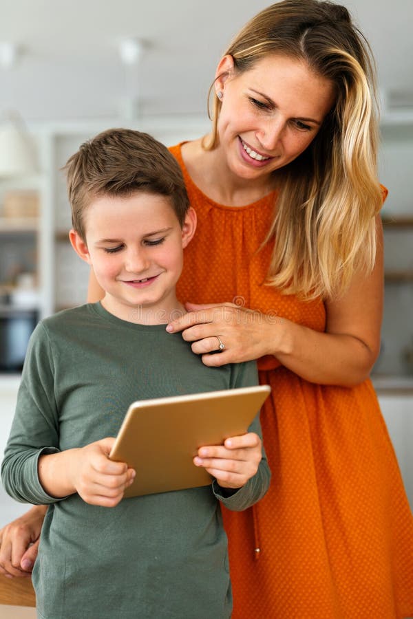 Mother and Child Using Digital Tablet for E-learning. Education Home ...