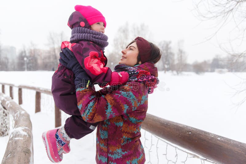 Mother with Child in Winter Stock Image - Image of embracing, daughter ...
