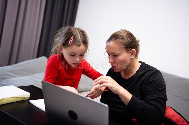 Mother and Child Working on a Computer. Parent is Helping a Young Child ...