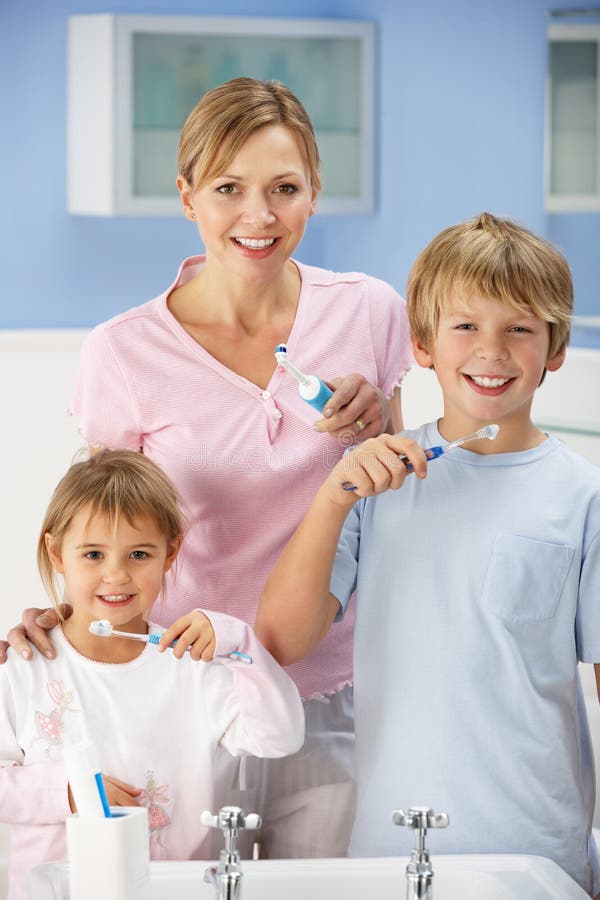 Mother and Children Cleaning Teeth in Bathroom Stock Photo - Image of ...