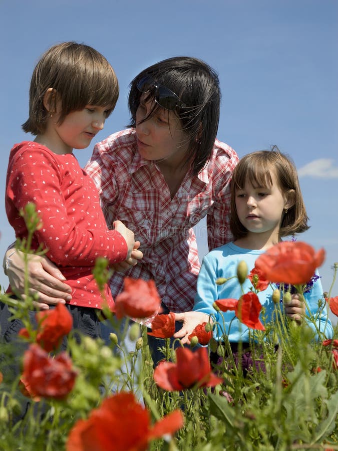 Mother and Children in Red Poppy Stock Image - Image of wind, flower ...