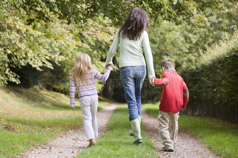 Mother and Children Walking on Woodland Path Stock Photo - Image of ...