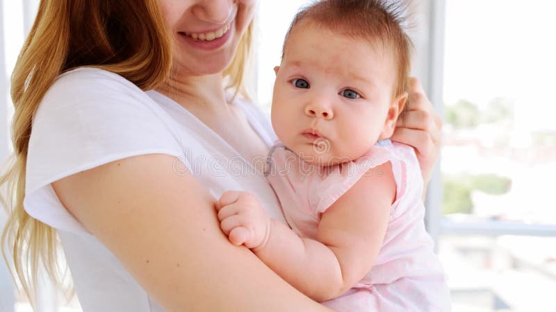 Mother comforting baby stock footage. Video of love - 168734260