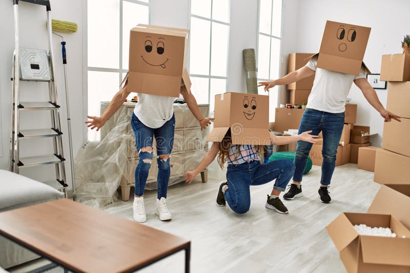 Mother and Couple Playing with Funny Cardboard Box on Head at Home ...