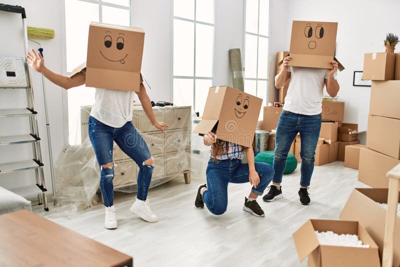 Mother and Couple Playing with Funny Cardboard Box on Head at Home ...