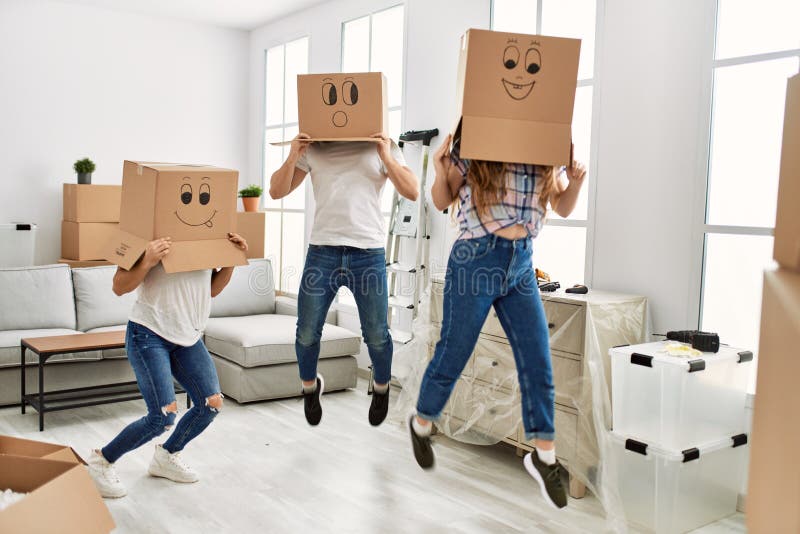 Mother and Couple Playing with Funny Cardboard Box on Head at Home ...
