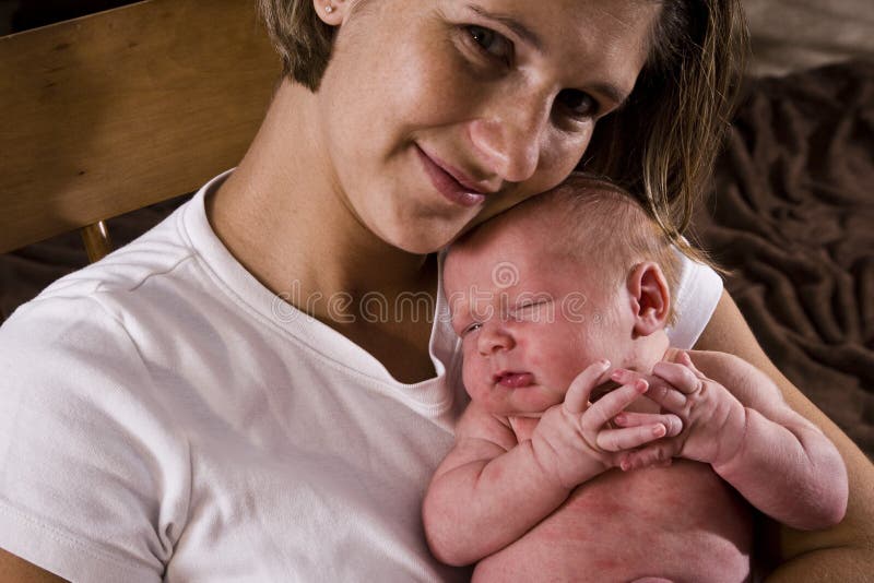 Mother Rocking Newborn Baby by Window Stock Photo - Image of curtain ...