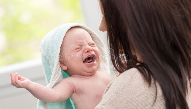 Mother and crying baby stock photo. Image of towel, baby - 121196582