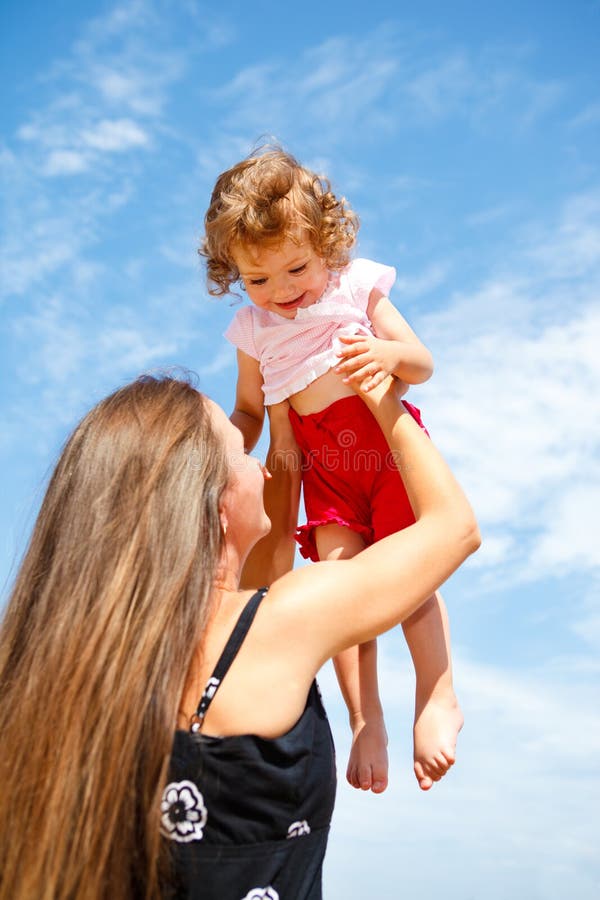 Mother raising baby stock image. Image of life, leisure - 9764231