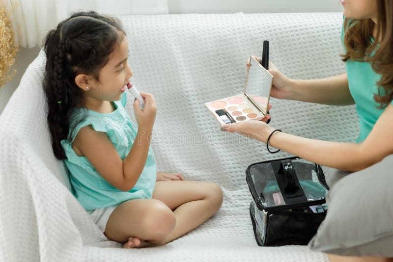 Mother and Daughter Applying Makeup Stock Photo - Image of attractive ...