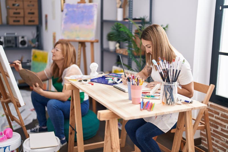 Mother and Daughter Artists Smiling Confident Drawing at Art Studio ...