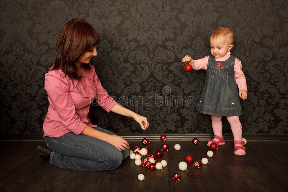 Mother and Daughter Consider Christmas Decorations Stock Image - Image ...