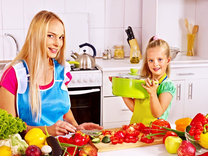 Mother and Daughter Cooking at Kitchen. Stock Photo - Image of daughter ...