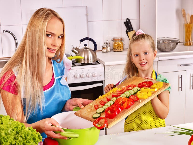 Mother and Daughter Cooking at Kitchen Stock Photo - Image of indoors ...