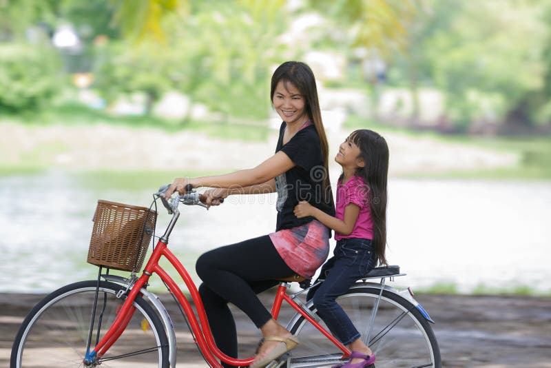 Mother and a Daughter Cycling Bicycle Stock Image - Image of forest ...