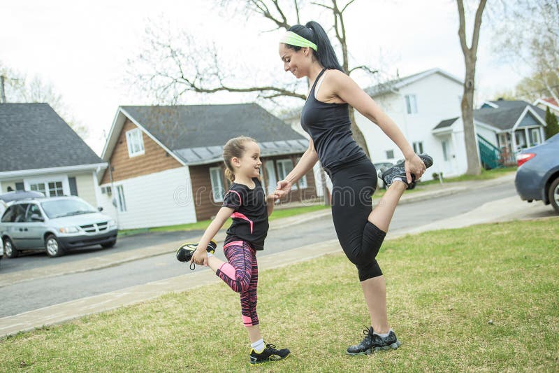 Mother and Daughter Doing Exercises Together Stock Photo - Image of ...