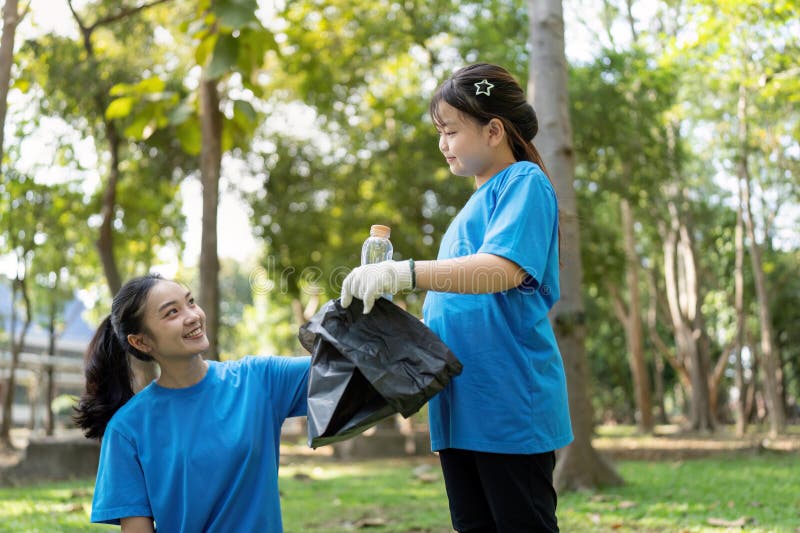 Family Members Working Together To Collect Garbage during a Community ...