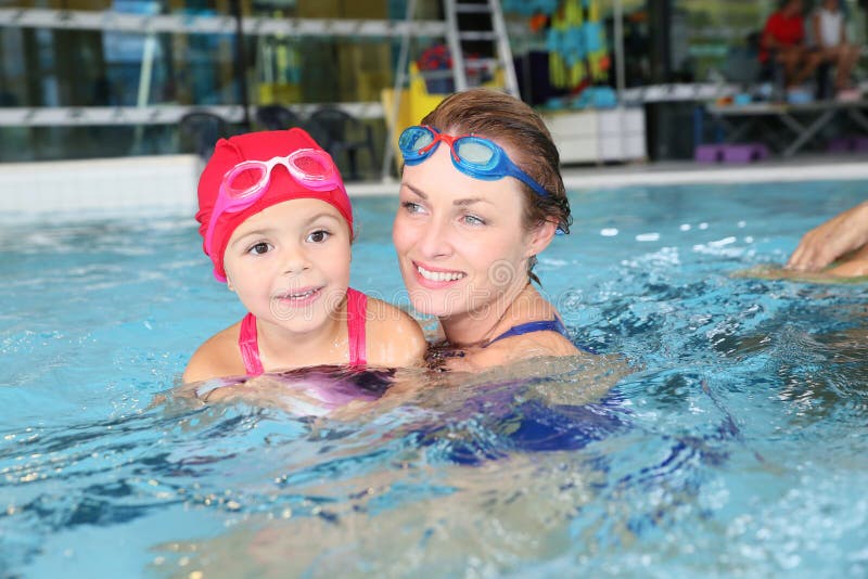 Mother and Daughter Enjoying in Swimming Pool Stock Photo - Image of ...