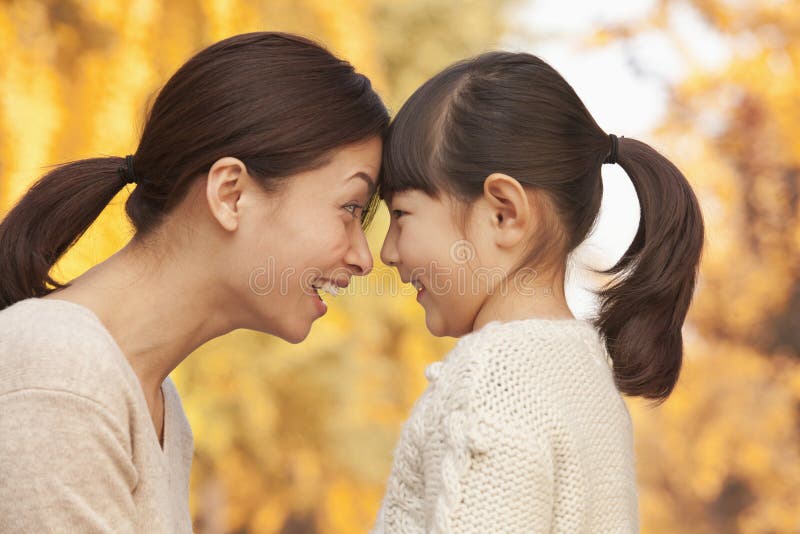 Mother and Daughter Face To Face Stock Image - Image of color ...