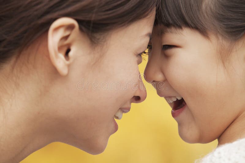 Mom and Daughter Face Off stock photo. Image of resemblance - 8432132