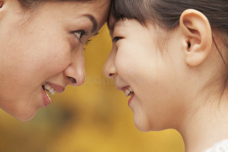 Mother and Daughter Face To Face Stock Photo - Image of closeup ...
