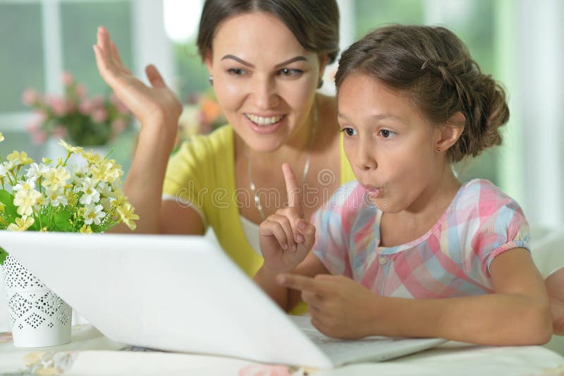 Mother and Daughter Have an Idea while Using Laptop Stock Image - Image ...