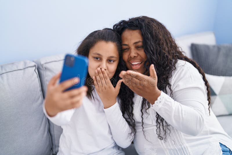 Mother and Daughter Having Video Call Sitting on Sofa at Home Stock ...