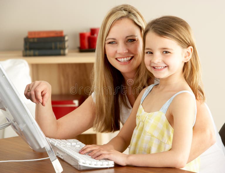 Mother and Daughter at Home Using Computer Stock Photo - Image of ...