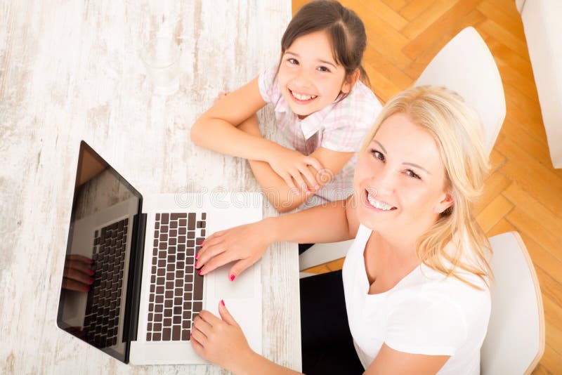 Mother and Daughter with a Laptop at Home Stock Photo - Image of ...