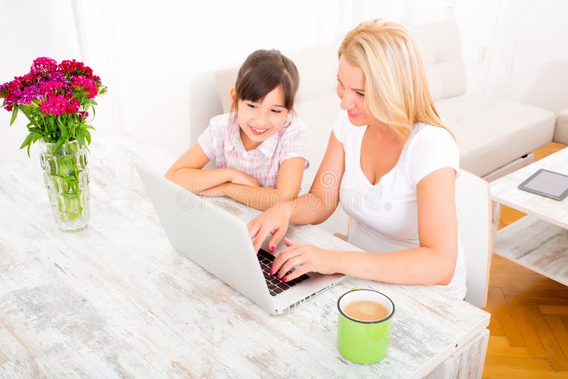 Mother and Daughter with a Laptop at Home Stock Photo - Image of ...