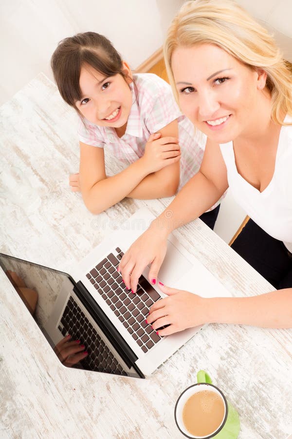 Mother and Daughter with a Laptop at Home Stock Photo - Image of people ...