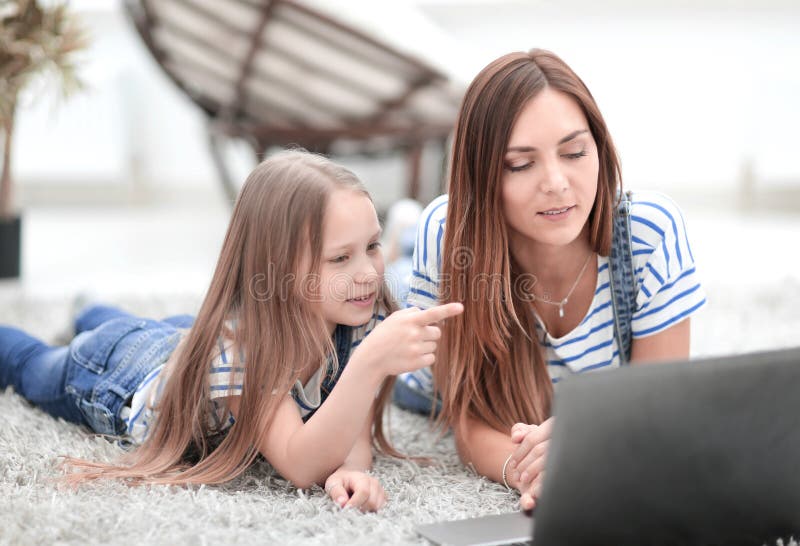Mother and Daughter Looking at the Laptop Screen. Stock Image - Image ...