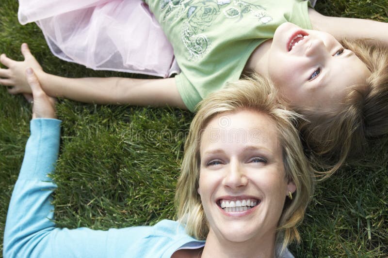 Mother And Daughter Lying On Grass Stock Image Image Of Person Angle