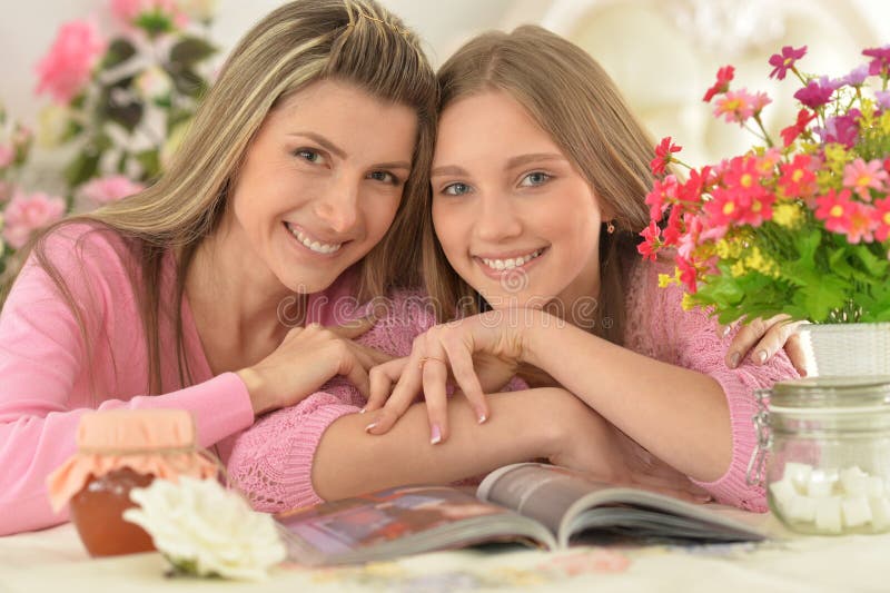 Mother with Daughter with Magazine Stock Image - Image of lady ...
