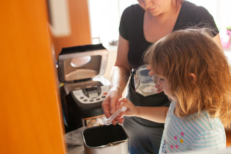Mother and Daughter Making Bread Together at Home Kitchen Stock Photo ...
