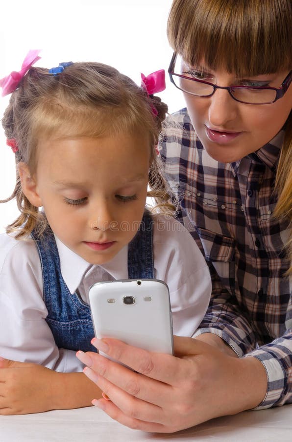 Mother and Daughter with Mobile Phone Stock Photo - Image of brunette ...