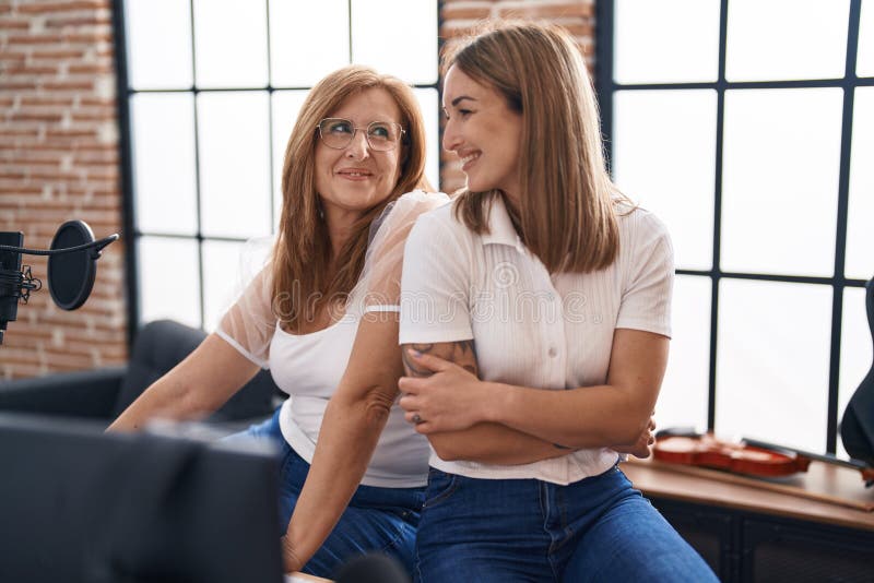 Mother and Daughter Musicians Smiling Confident at Music Studio Stock ...