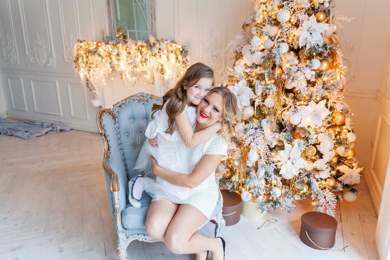 Mother And Daughter Near A Christmas Tree Stock Image Image Of