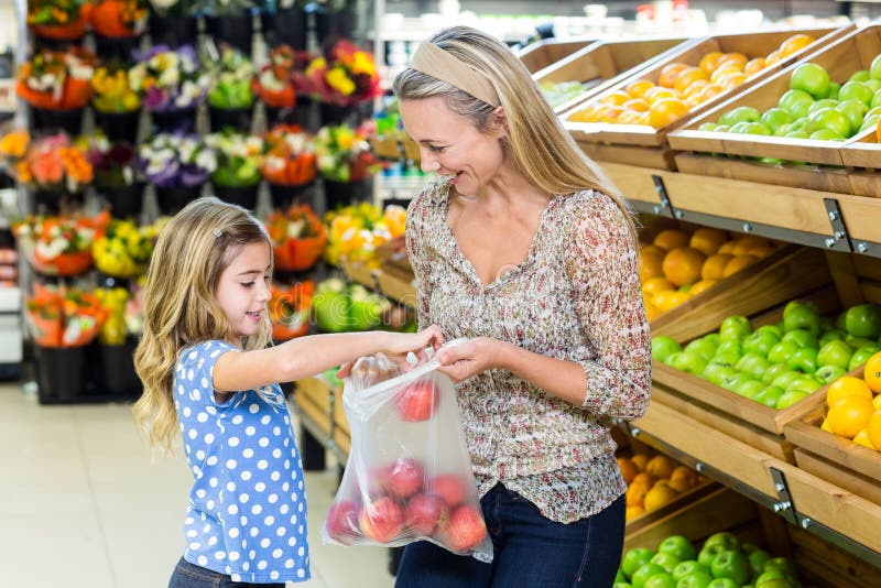 Mother and Daughter Picking Out Apple Stock Photo - Image of mother ...