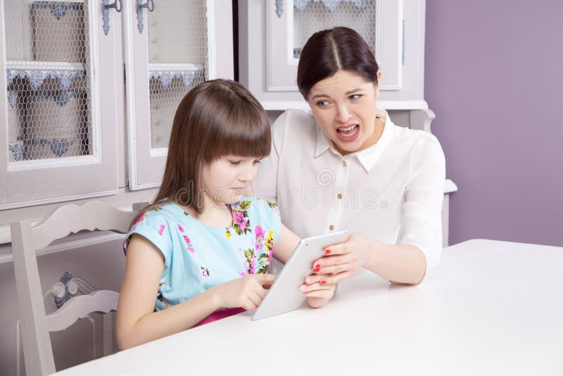 Mother and Daughter Quarrel because of Overuse Technology Stock Image ...