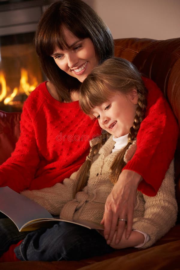 Side View of Mother and Daughter Reading a Book Together Stock Image ...