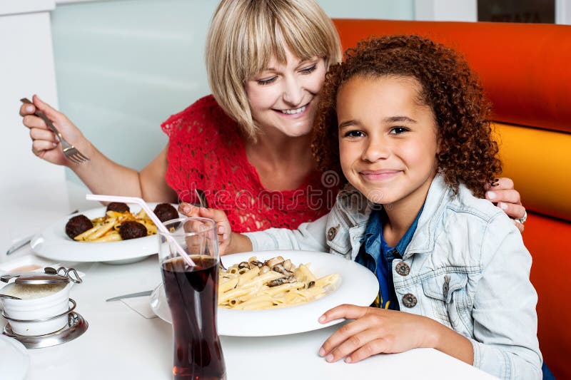 Mother and Daughter in a Restaurant Stock Image - Image of child ...