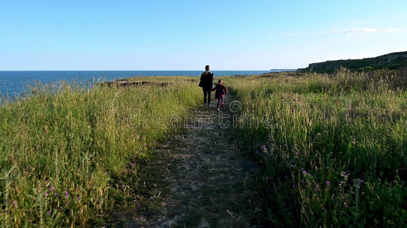Mother and Daughter Running on a Spring Path Stock Video - Video of ...